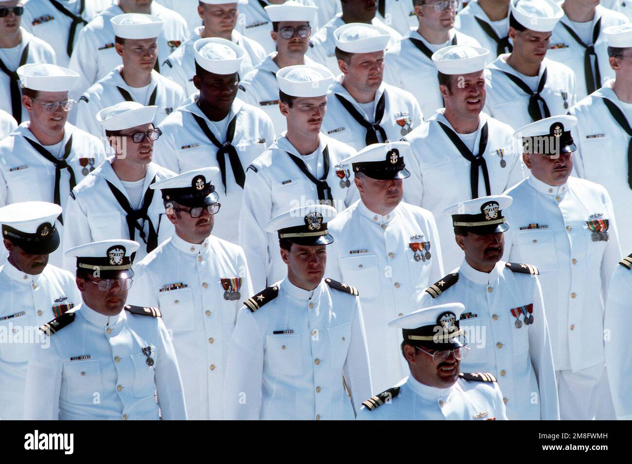 LCDR Louis Meier, lower left, executive officer of the guided missile ...
