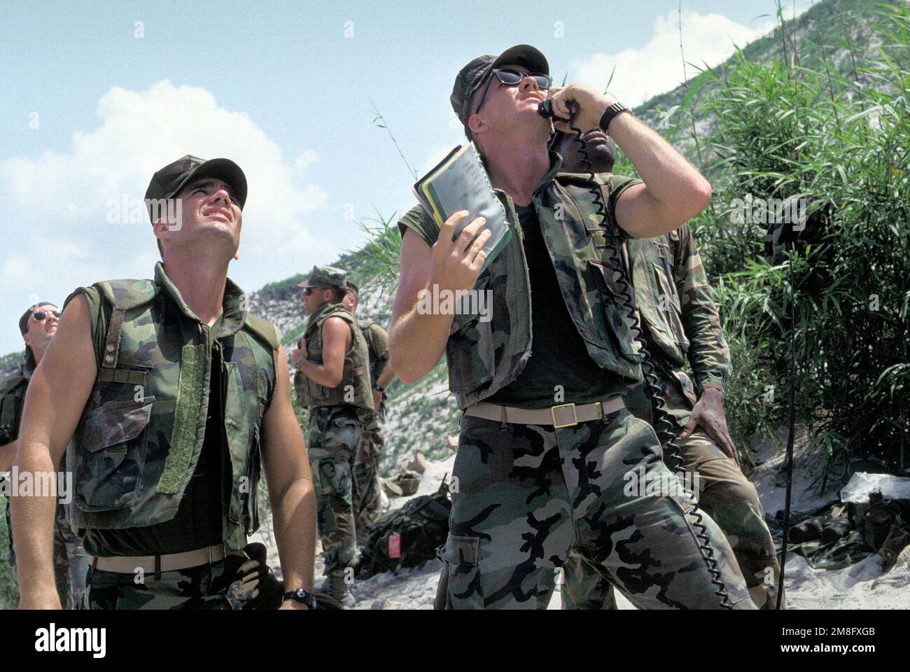 Members of a Marine tactical air control party (TACP) watch the ...