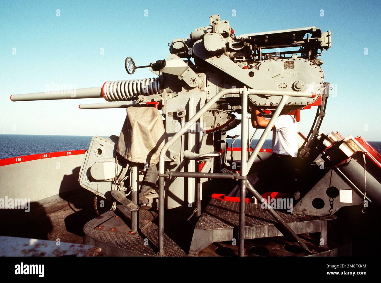 A gunner's mate aboard the amphibious transport dock USS RALEIGH (LPD-1 ...