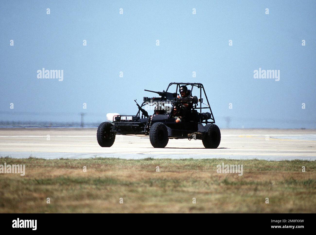 Three members of a U.S. Navy sea-air-land (SEAL) team ride in a ...