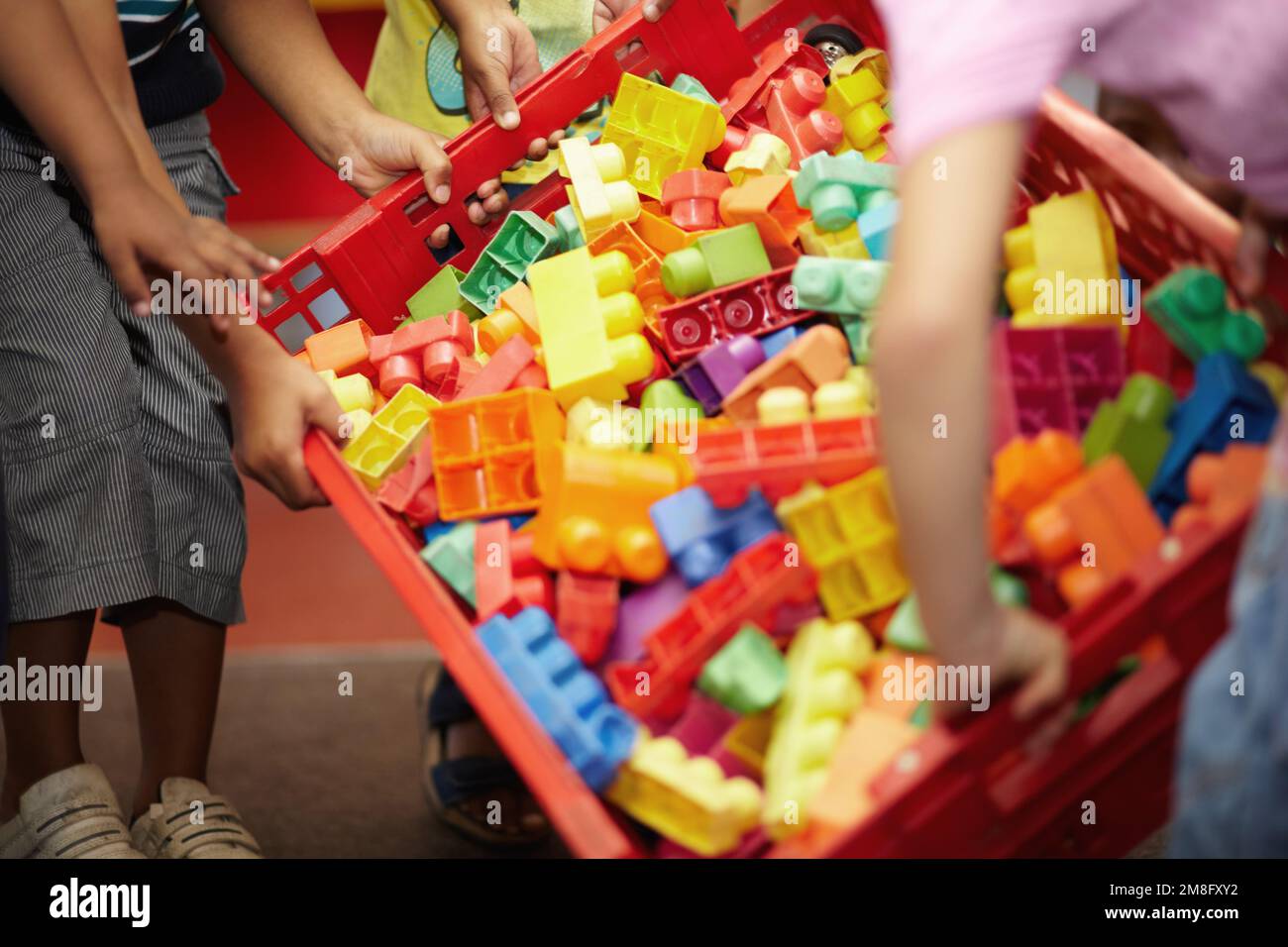 Colorful blocks to stimulate young minds. A huge box of large plastic ...