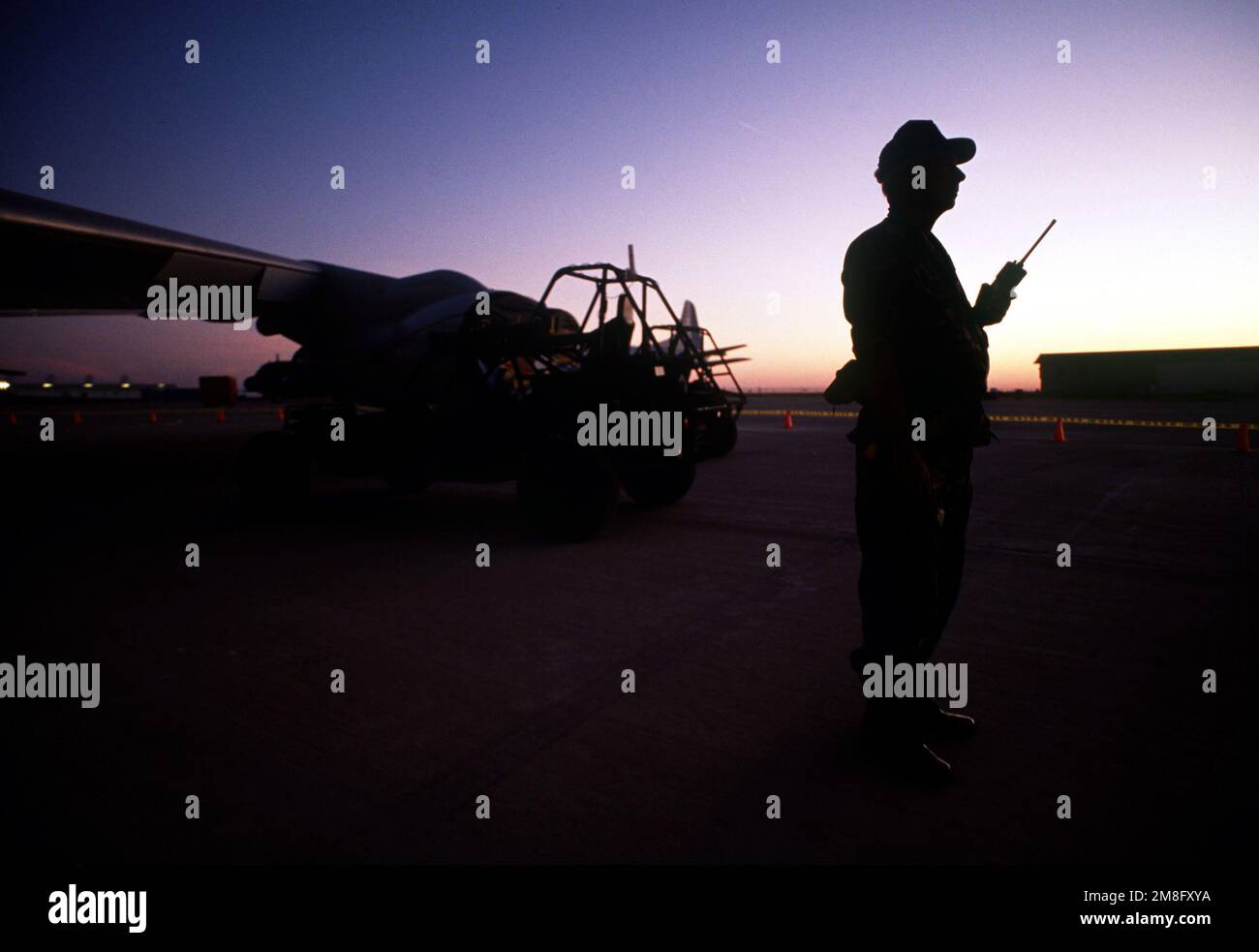 An airman stands near a Scorpion fast attack vehicle (FAV) parked ...