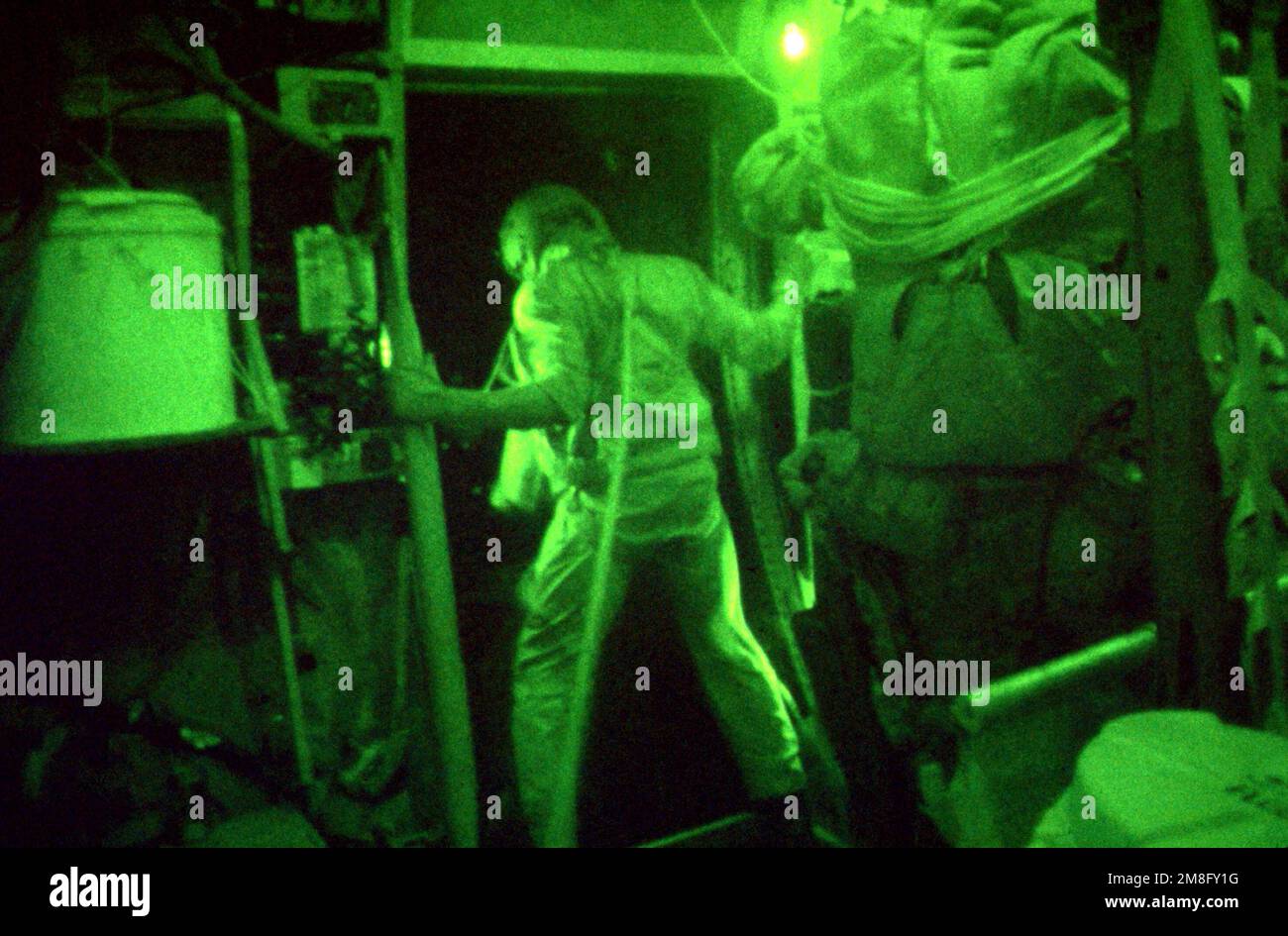 The loadmaster of a 317th Tactical Airlift Wing (TAW) C-130E Hercules ...