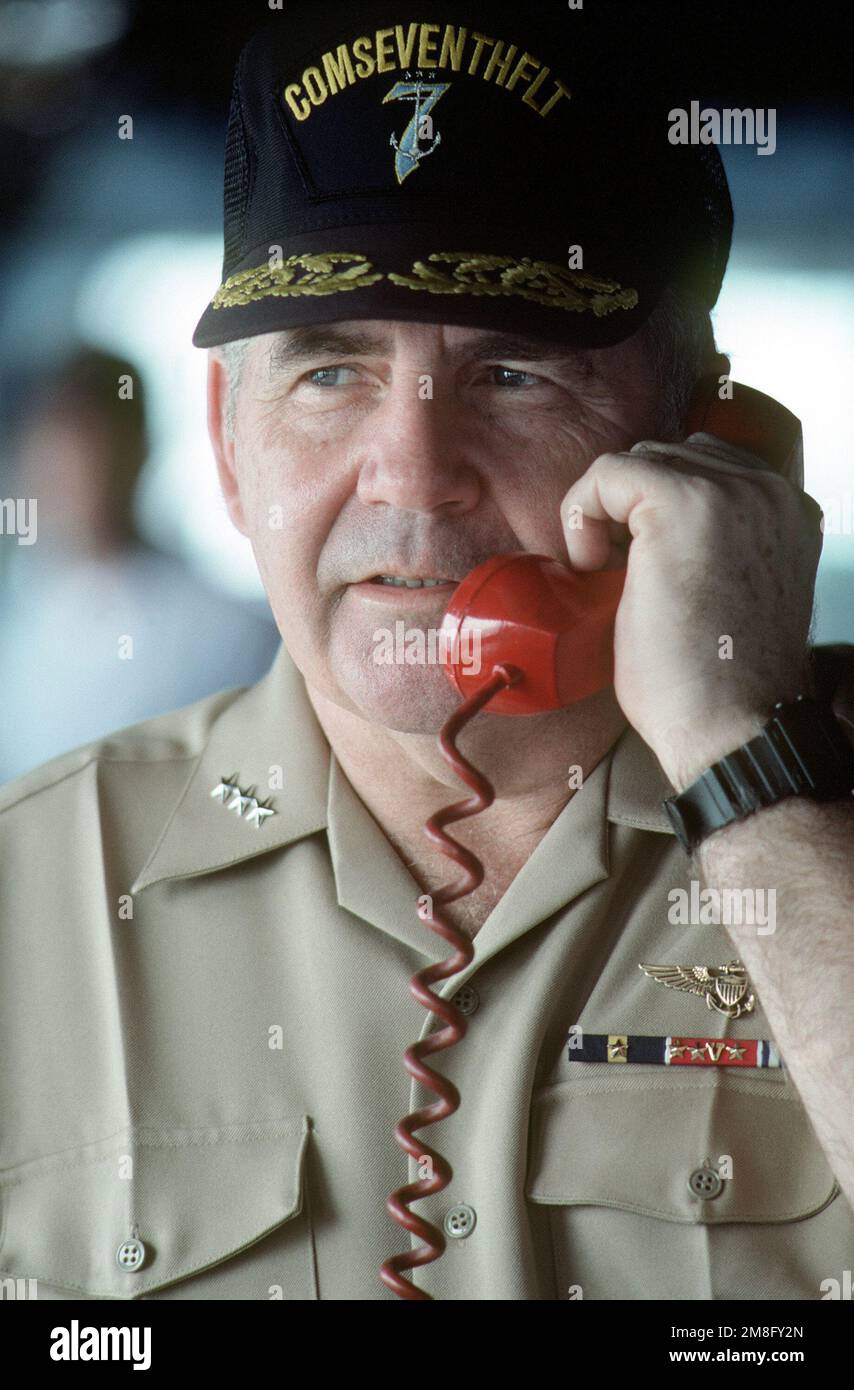 VADM Stanley R. Arthur, commander, Seventh Fleet, communicates with the ...