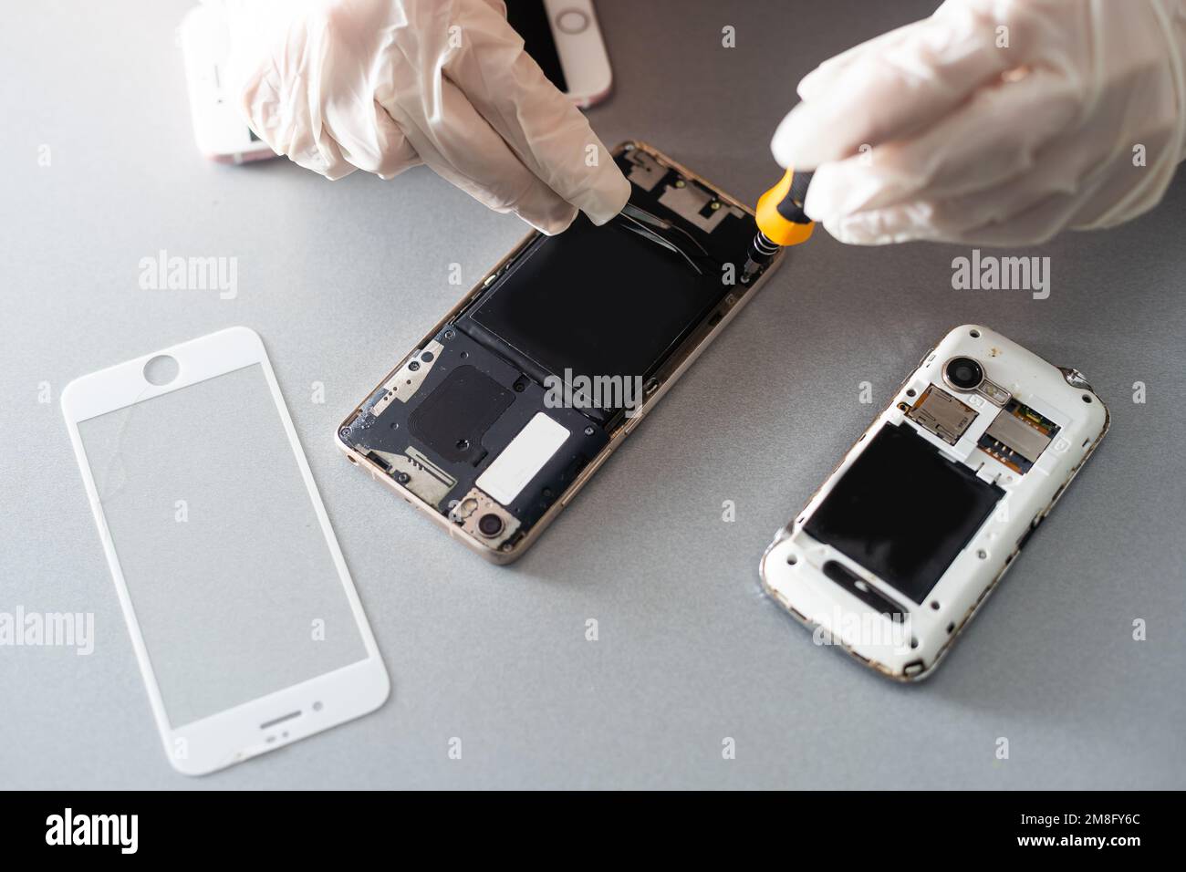 Close-up photos showing process of mobile phone repair Stock Photo - Alamy