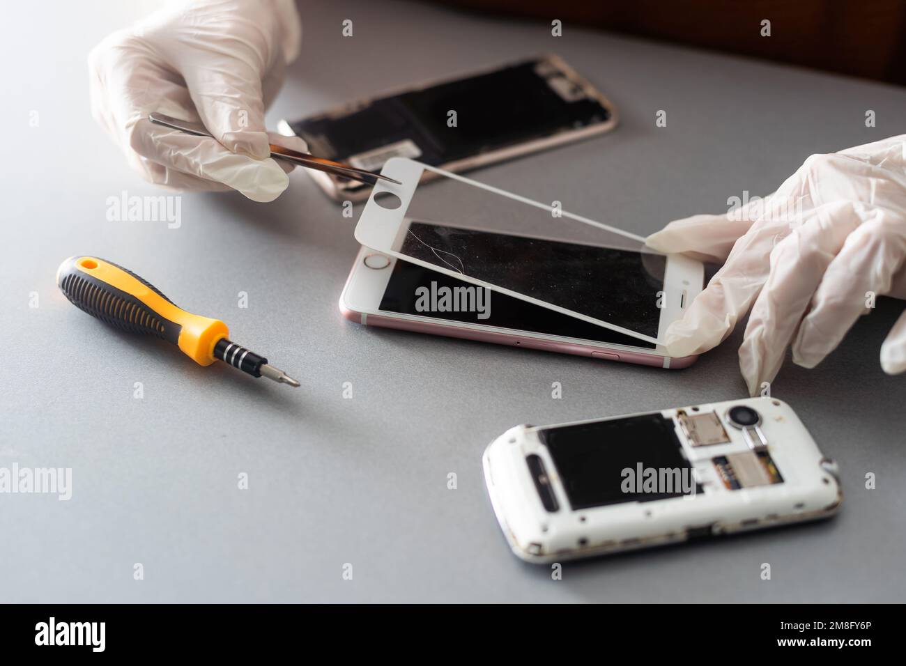 Technician prepairing to repair and replace new screen broken and ...