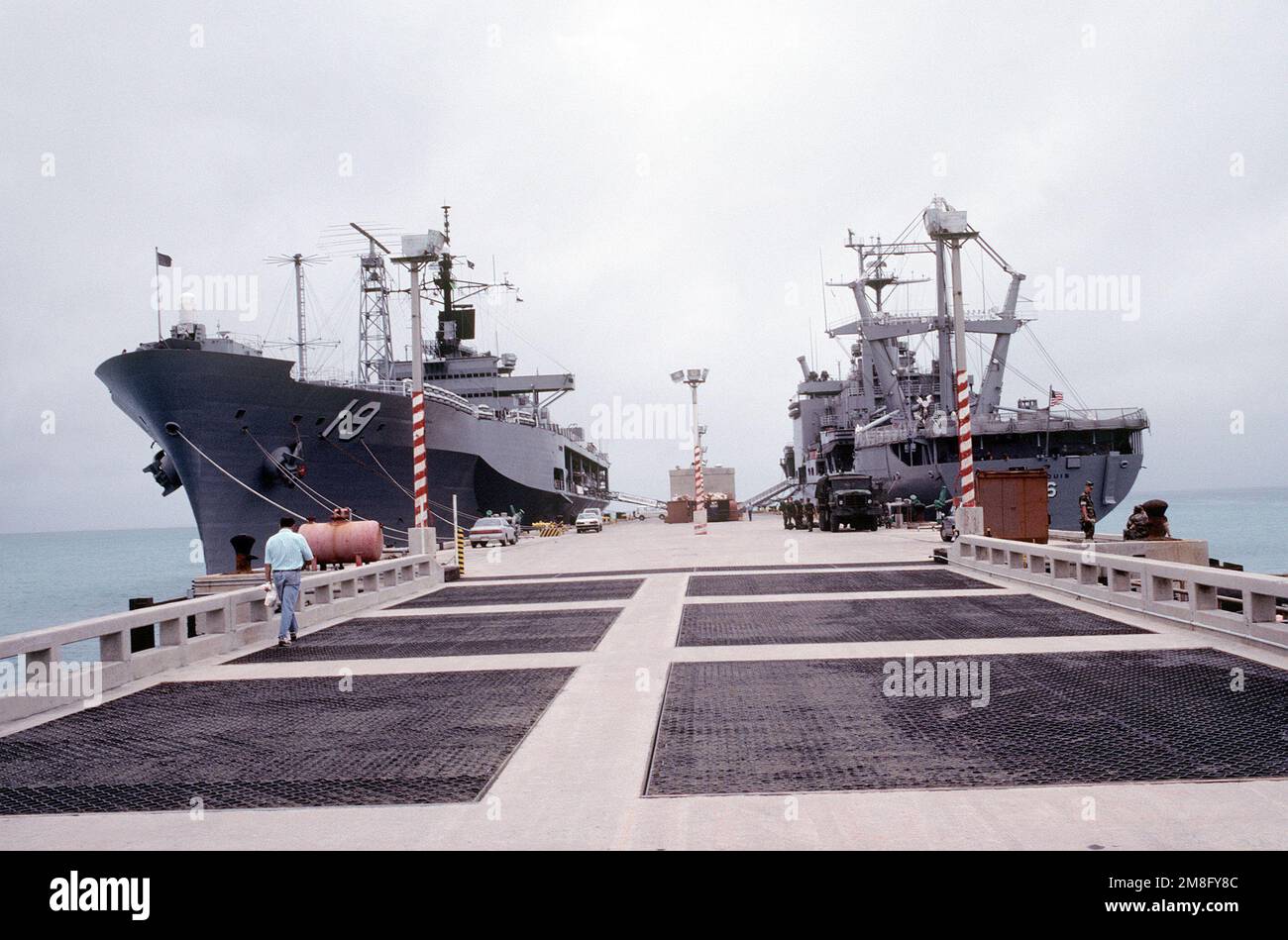 The amphibious command ship USS BLUE RIDGE (LCC 19), left, and the ...