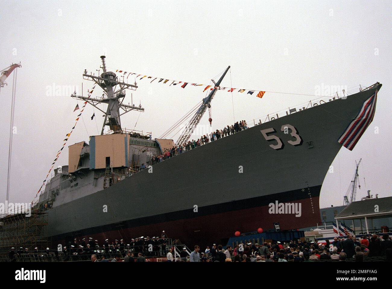 Shipyards workers stand aboard the guided missile destroyer JOHN PAUL ...