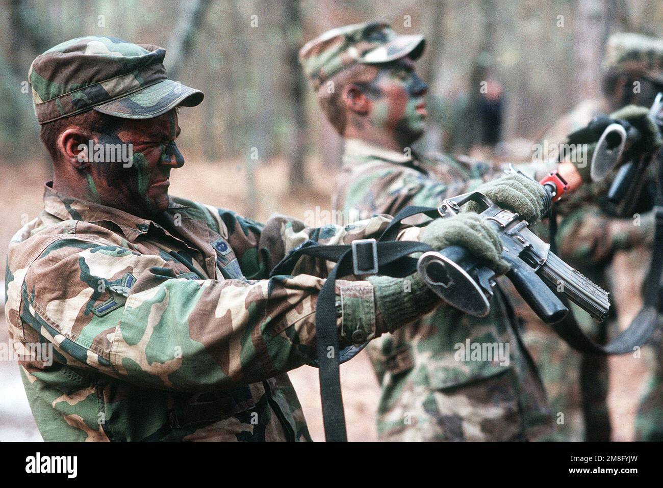 AIRMAN John Rogers does improvised strength building exercises with an ...