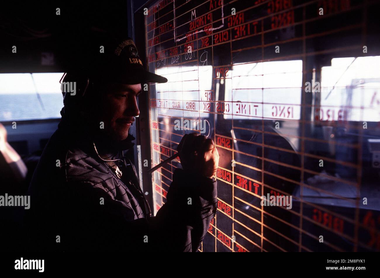 A crewman aboard the tank landing ship USS BARNSTABLE COUNTY (LST-1197 ...