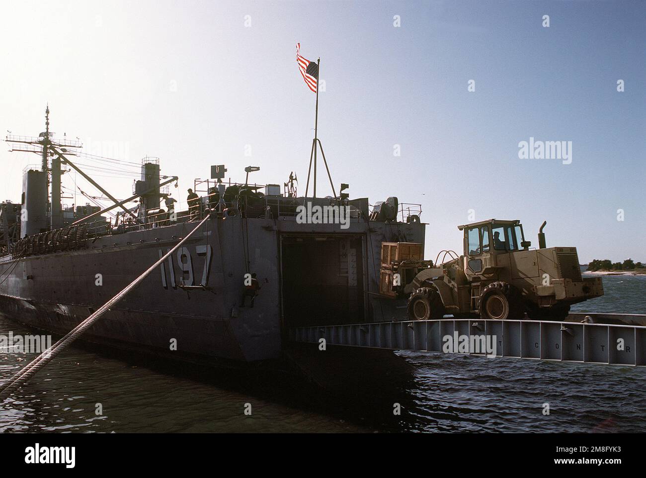 A rough terrain fork lift truck transports cargo onto the tank landing ...