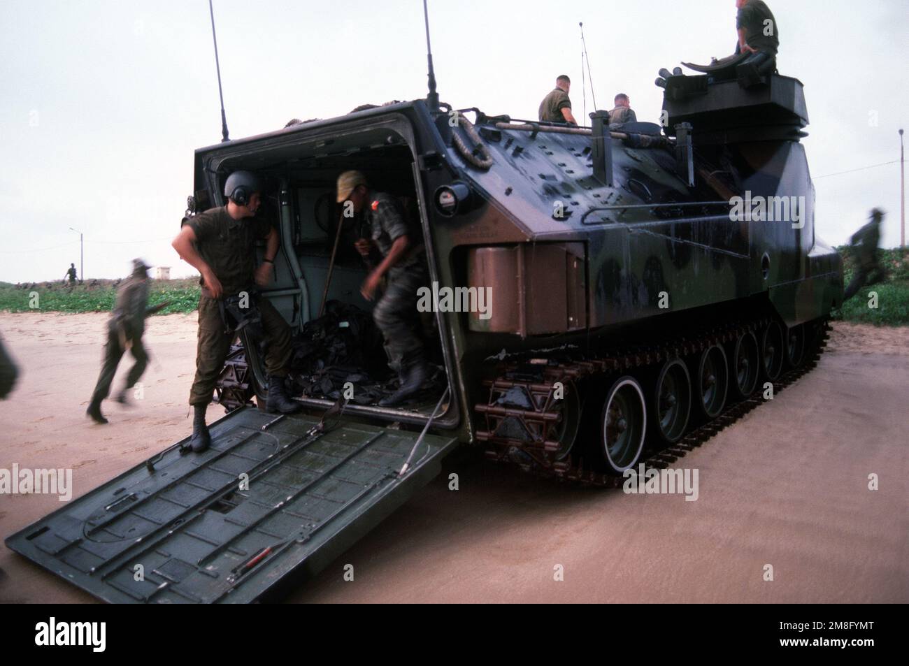 A U.S. Marine and a soldier from a West African nation descend out of ...