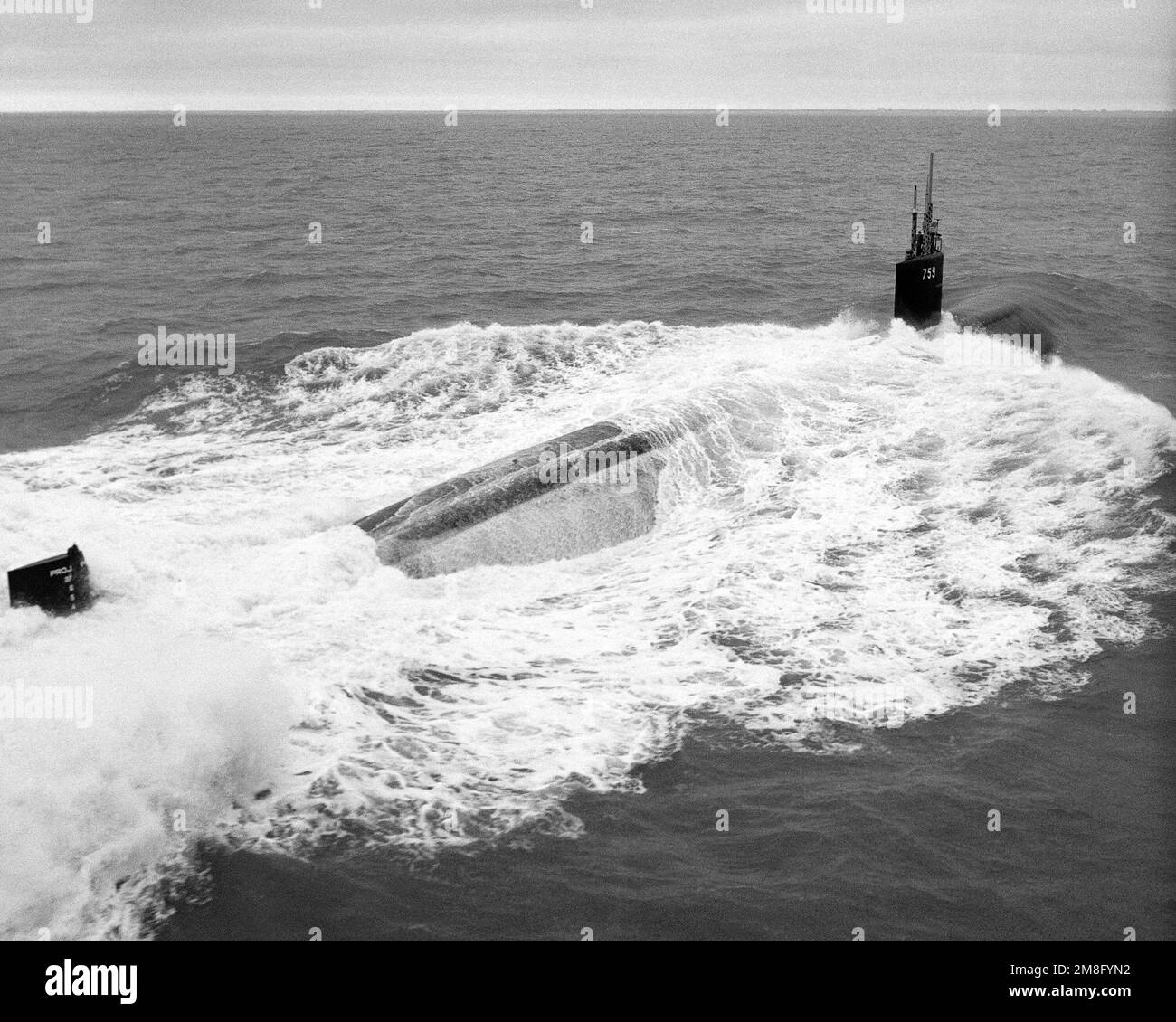 A starboard quarter view of the nuclear-powered attack submarine USS ...