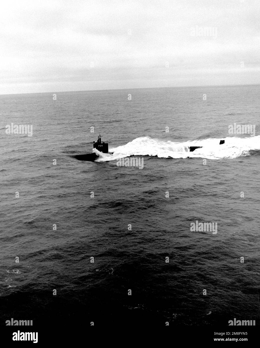 A port beam view of the nuclear-powered attack submarine JEFFERSON CITY ...