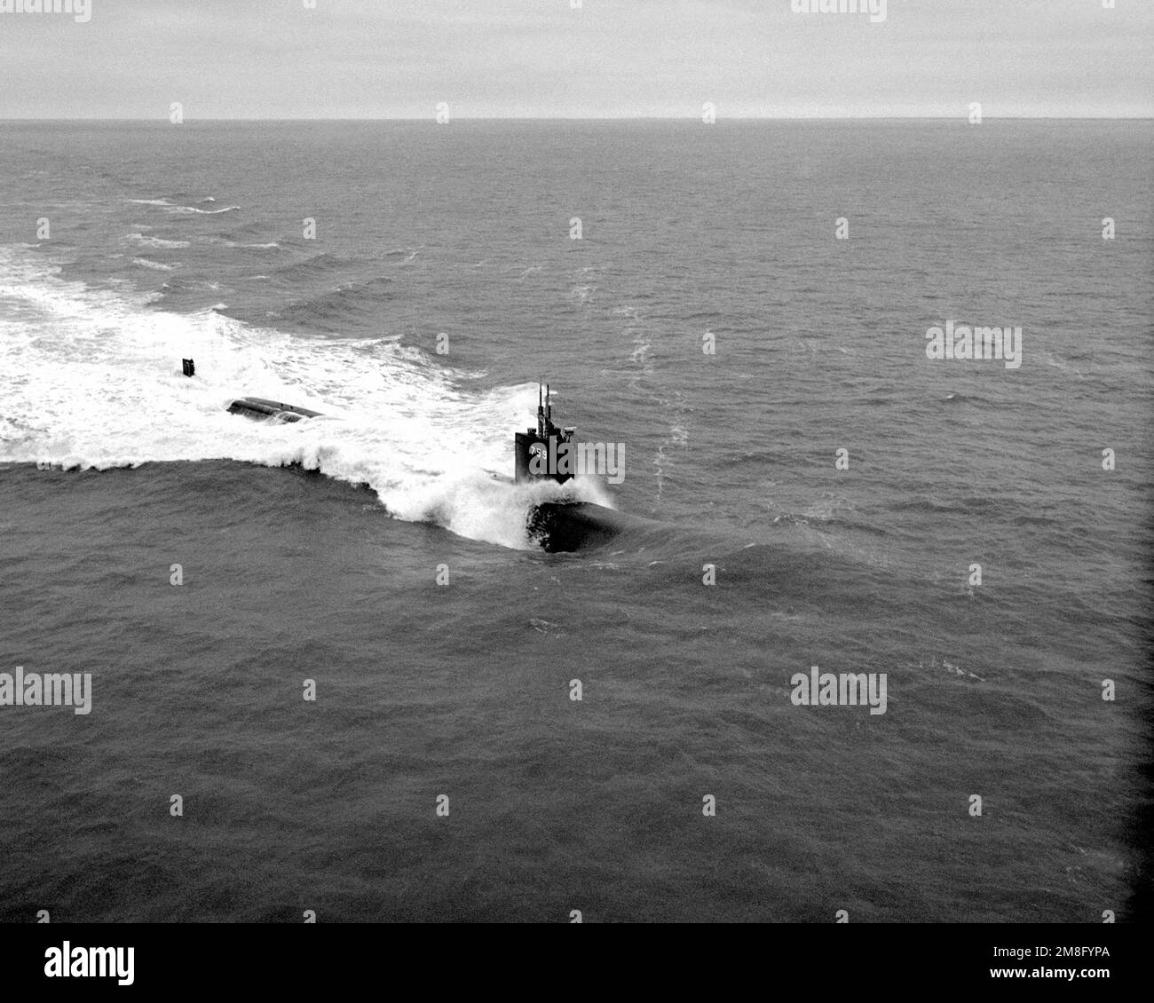 A starboard bow view of the nuclear-powered attack submarine USS ...