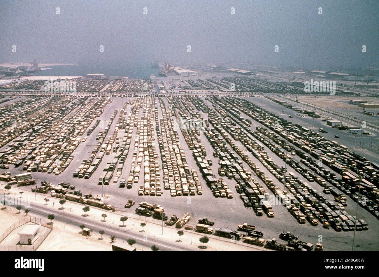 Military equipment lines a holding area in preparation for transport ...