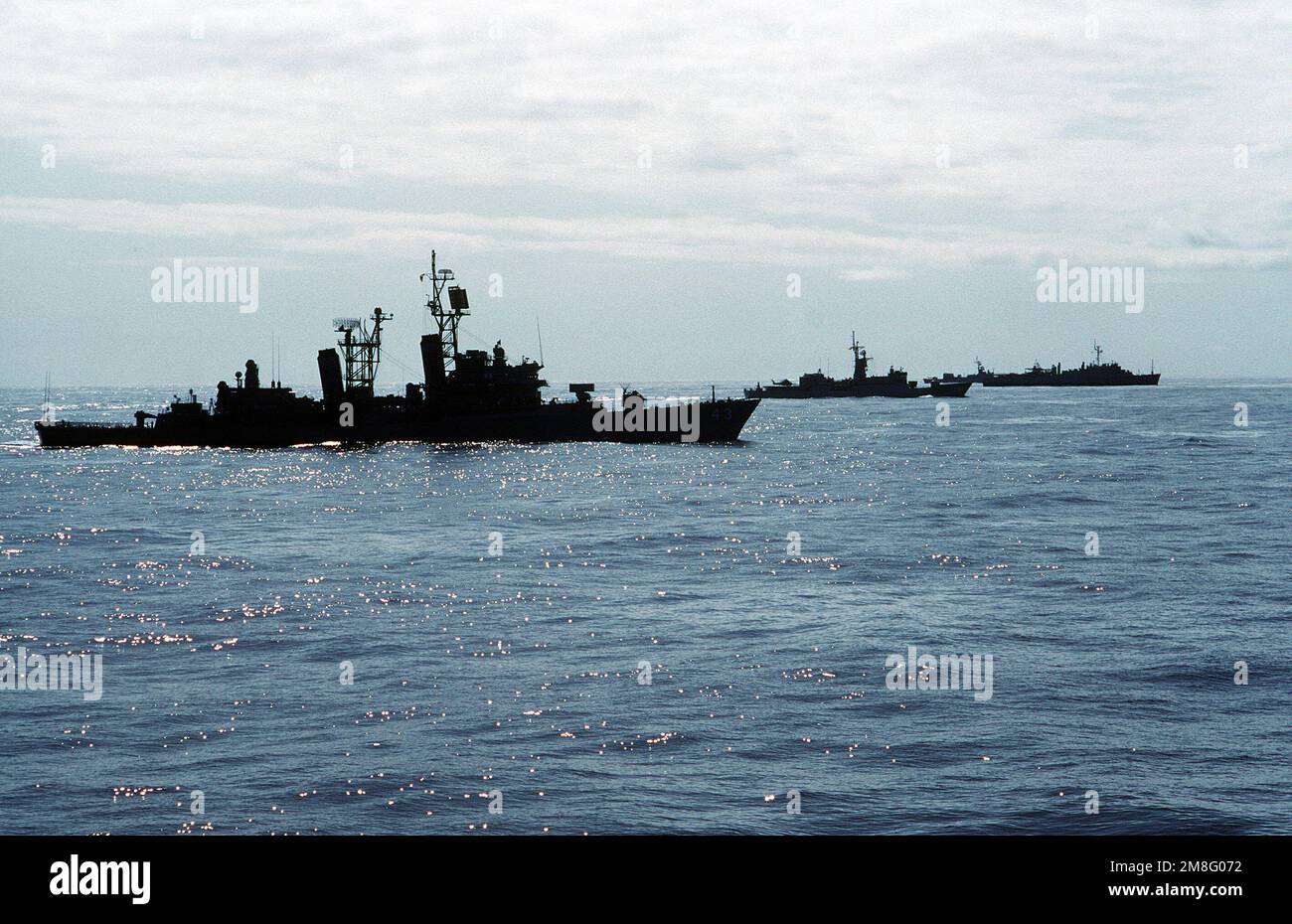 The guided missile destroyer USS DAHLGREN (DDG 43), left, the frigate ...