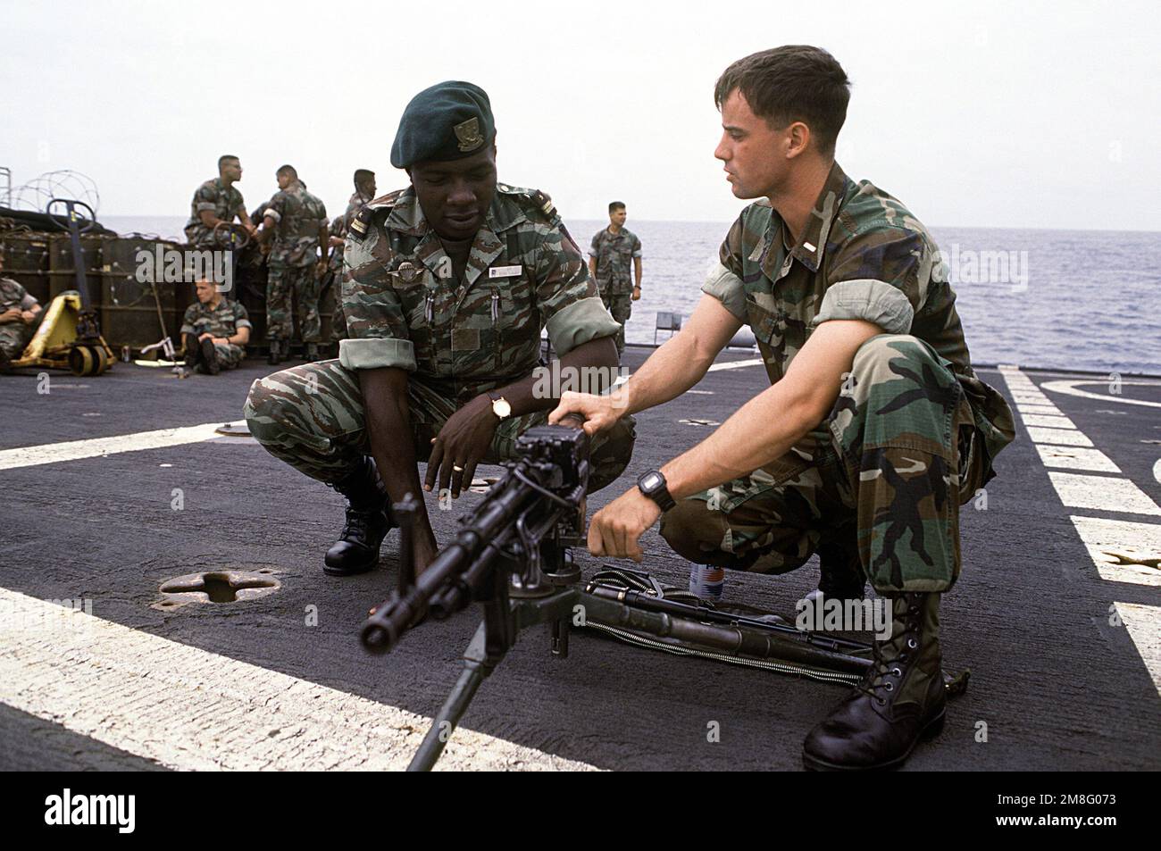 A Marine first lieutenant explains the opeartion of an M-60E3 machine ...