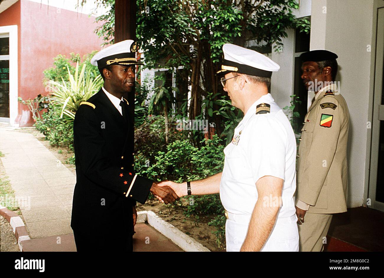 CMDR T. M. Hayes, right, the commanding officer of the tank landing ...