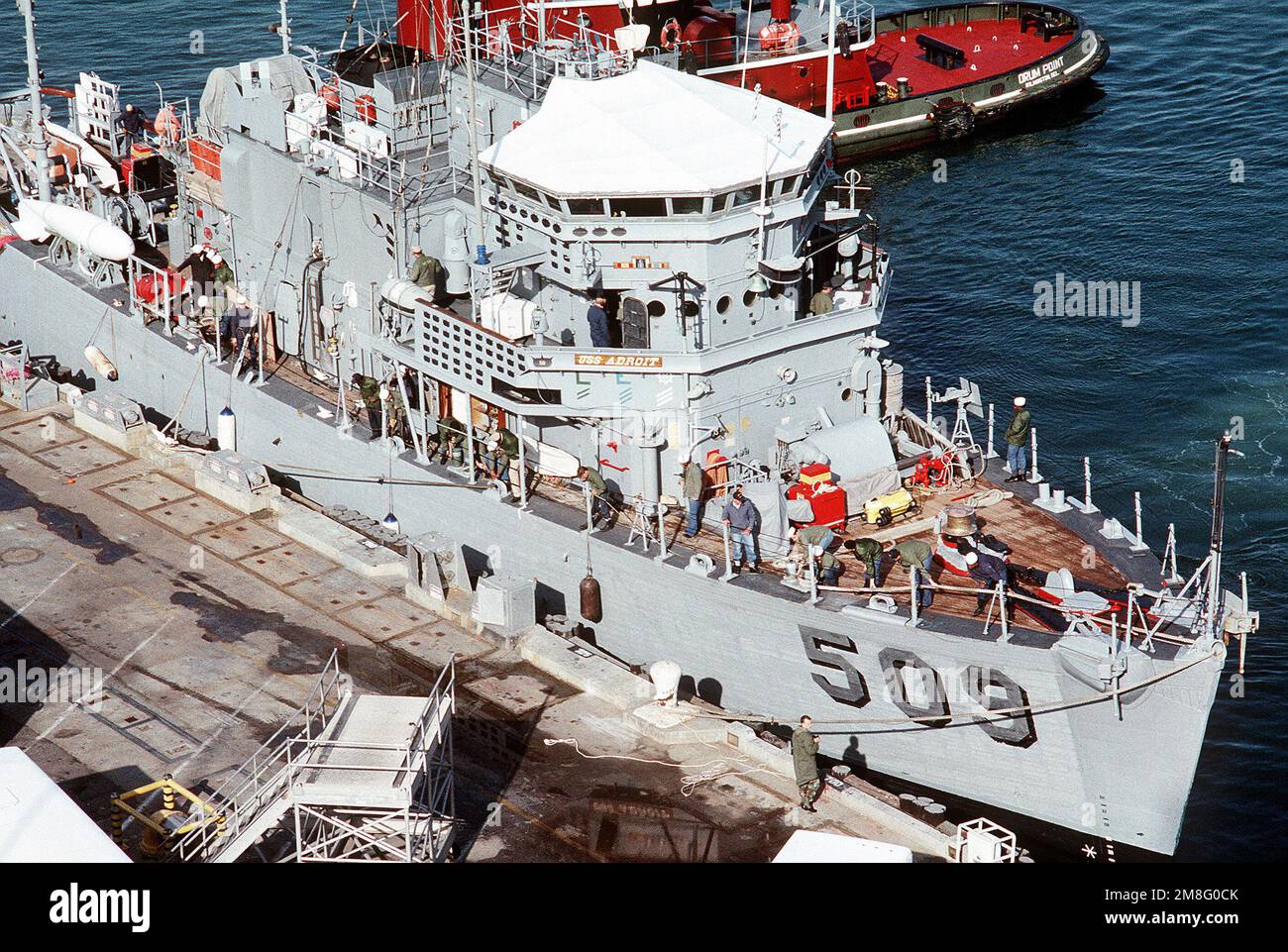 The ocean minesweeper USS ADROIT (MSO-509) ties up at the pier after ...