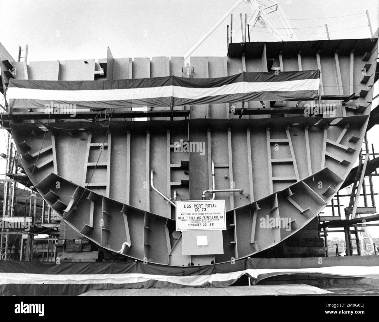 A plaque is posted near the guided missile cruiser USS PORT ROYAL (CG ...