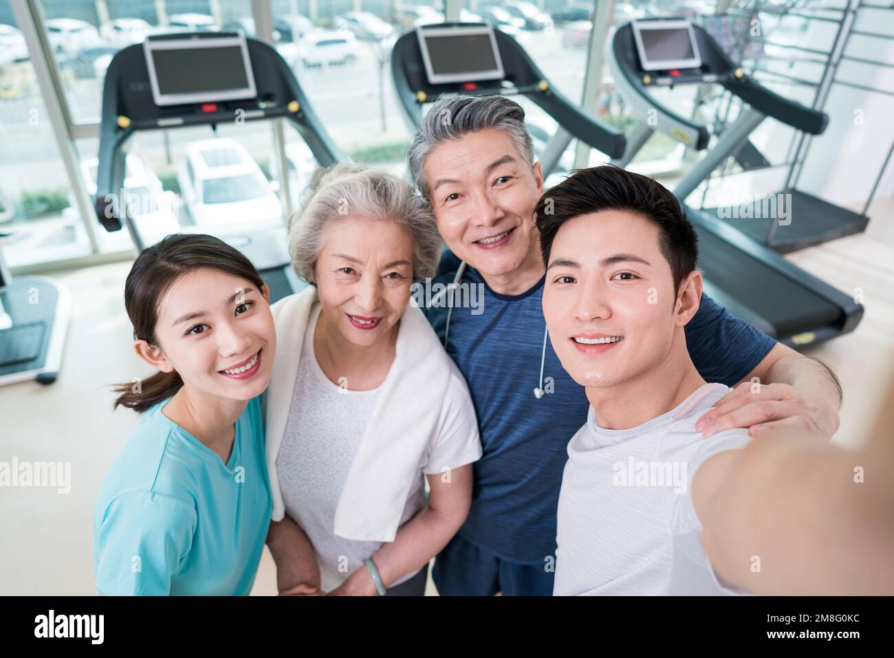 A family of four in the gym Stock Photo - Alamy