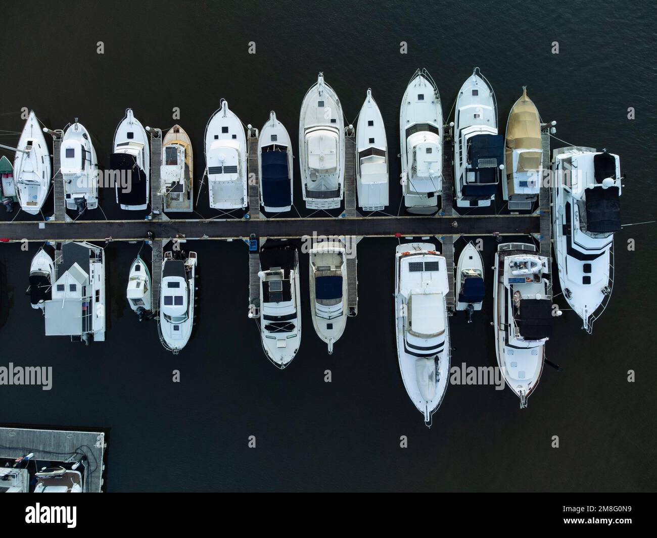 An aerial top view of boats in harbor on the tranquil Hawkesbury River ...