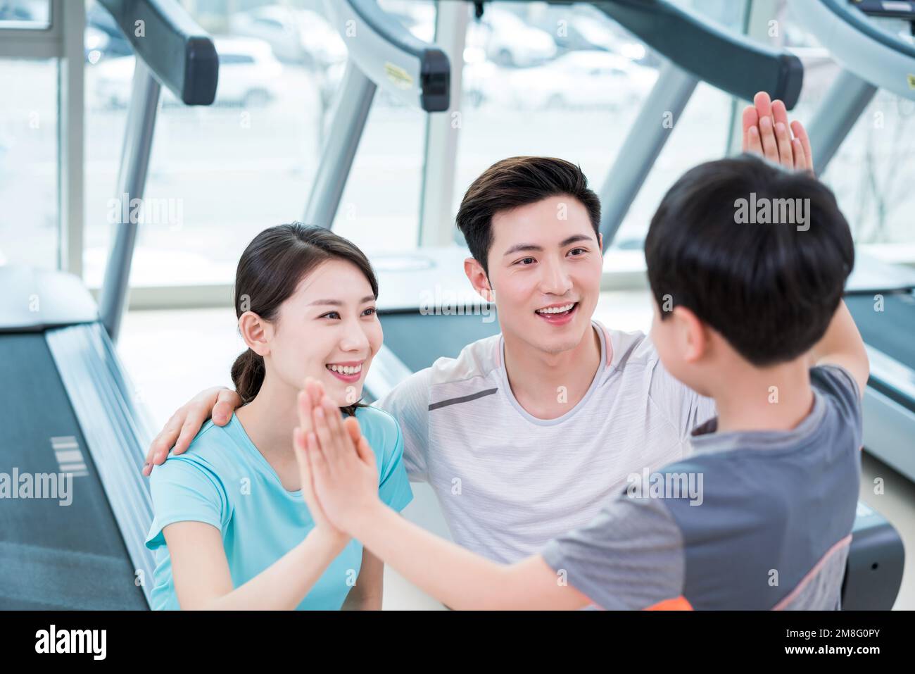 Three people smiling in a gym hi-res stock photography and images - Alamy