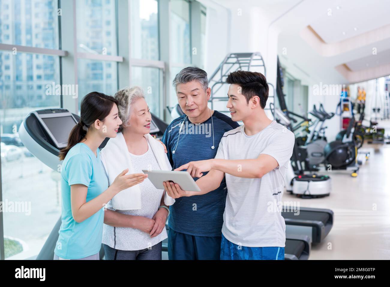 Three under the guidance of personal training in the gym for a workout ...