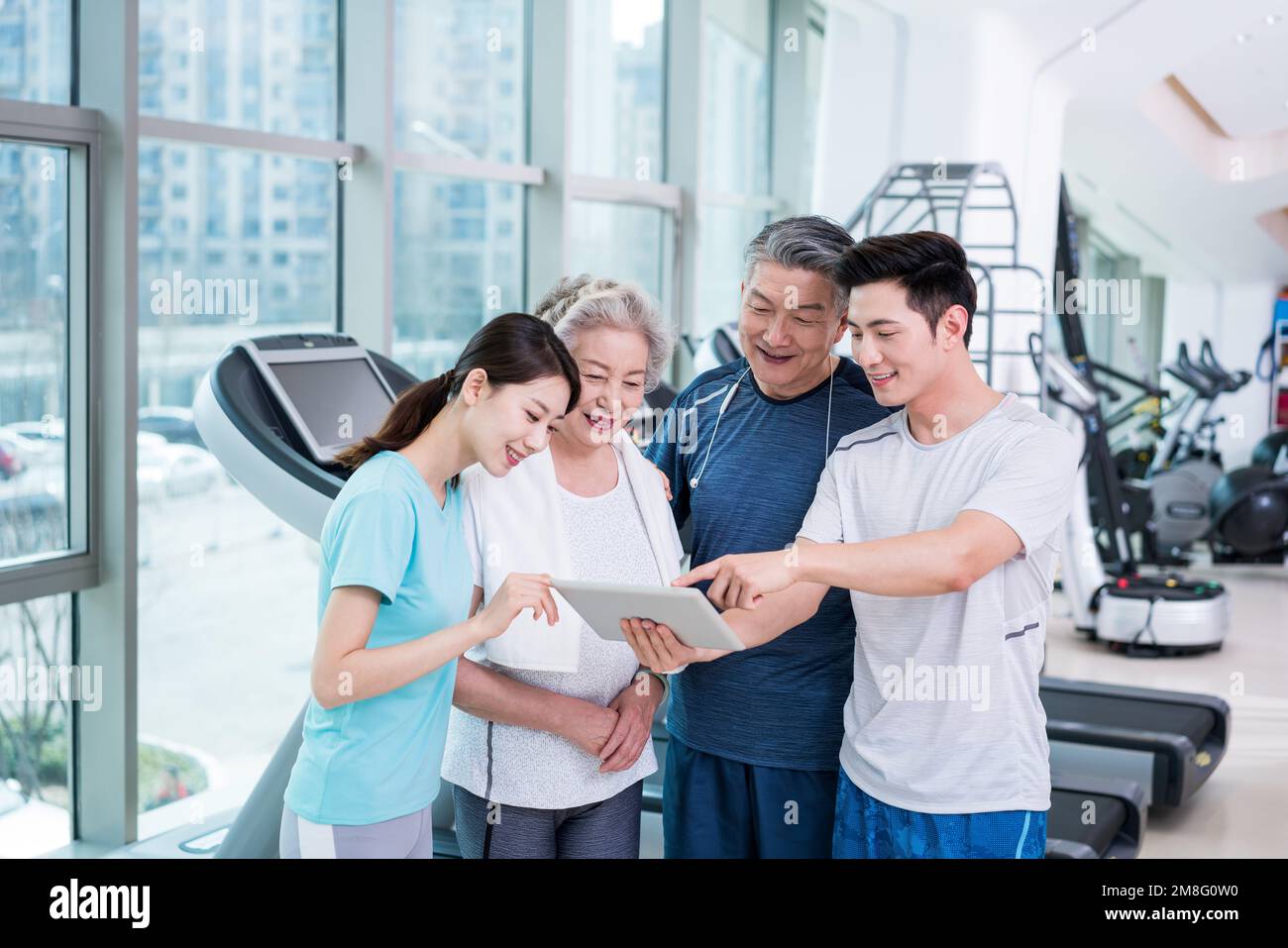 Three under the guidance of personal training in the gym for a workout ...