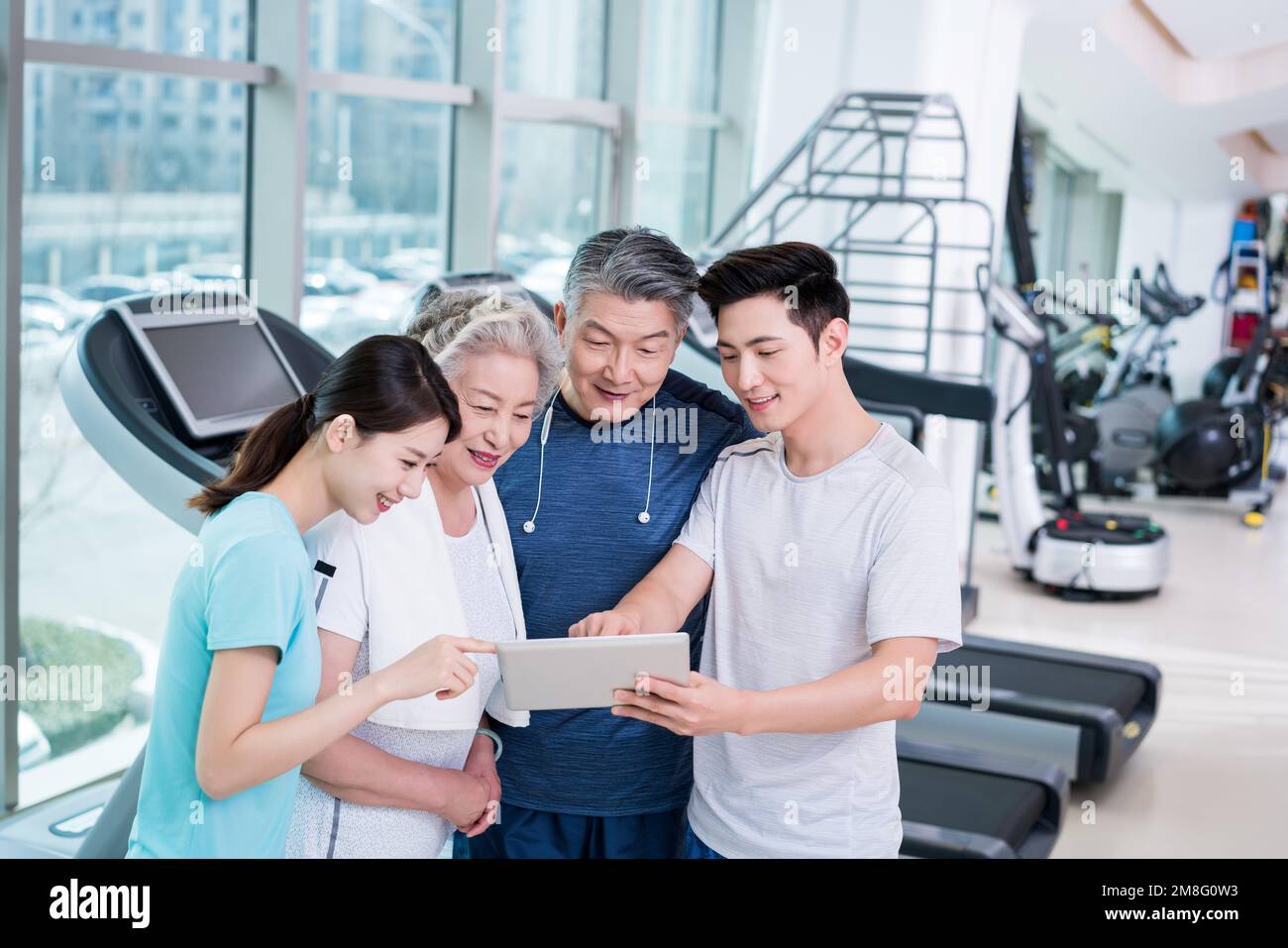 Three under the guidance of personal training in the gym for a workout ...