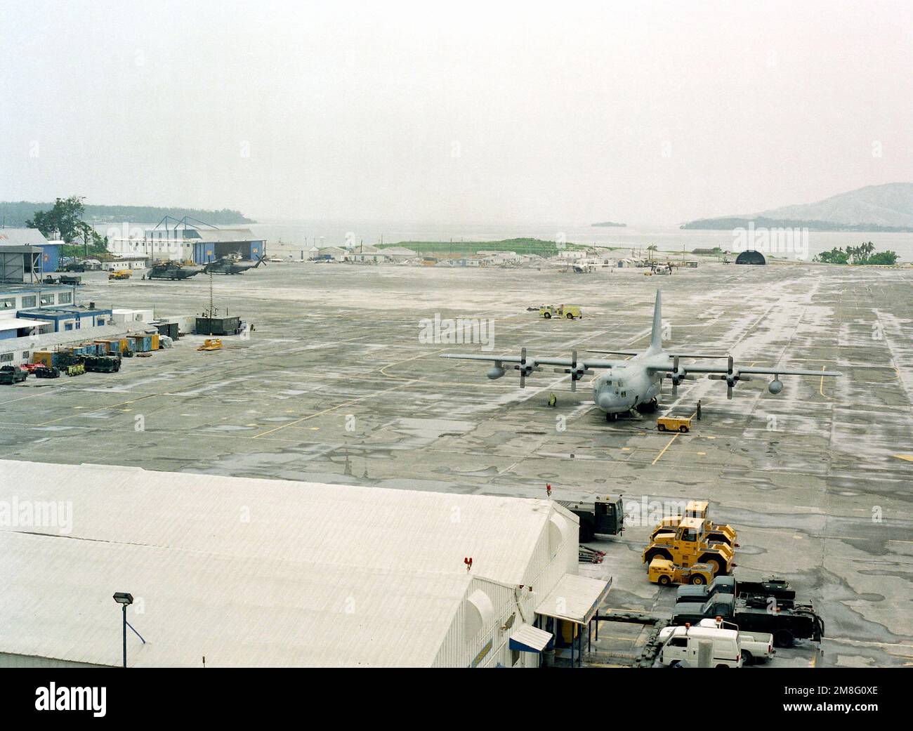 A C-130 Hercules aircraft stands on the flight line.. Base: Naval Air ...