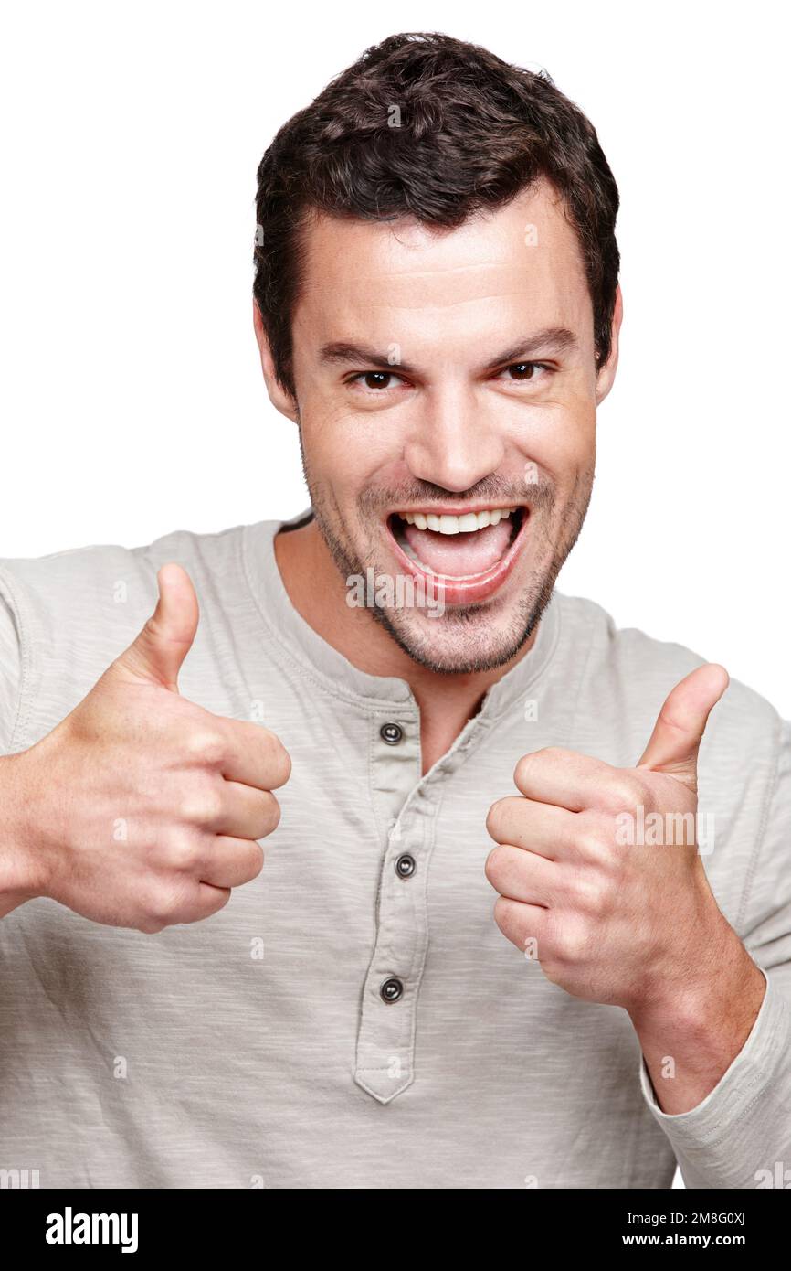 Portrait, thumbs up and support with a man in studio isolated on a ...