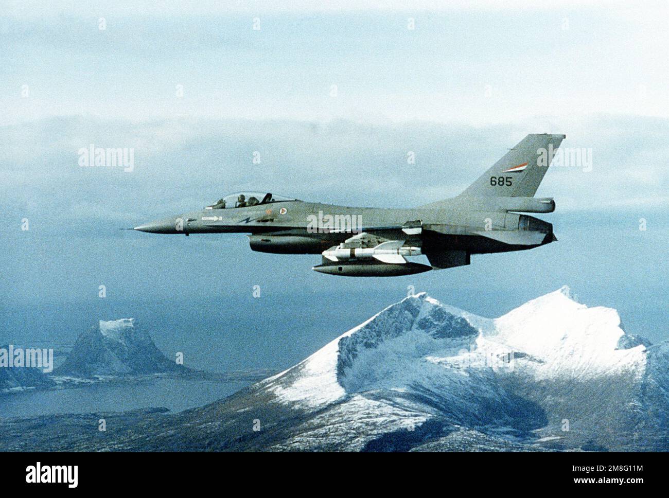 An AGM-119A Penguin anti-ship missile is mounted on the pylon of a ...