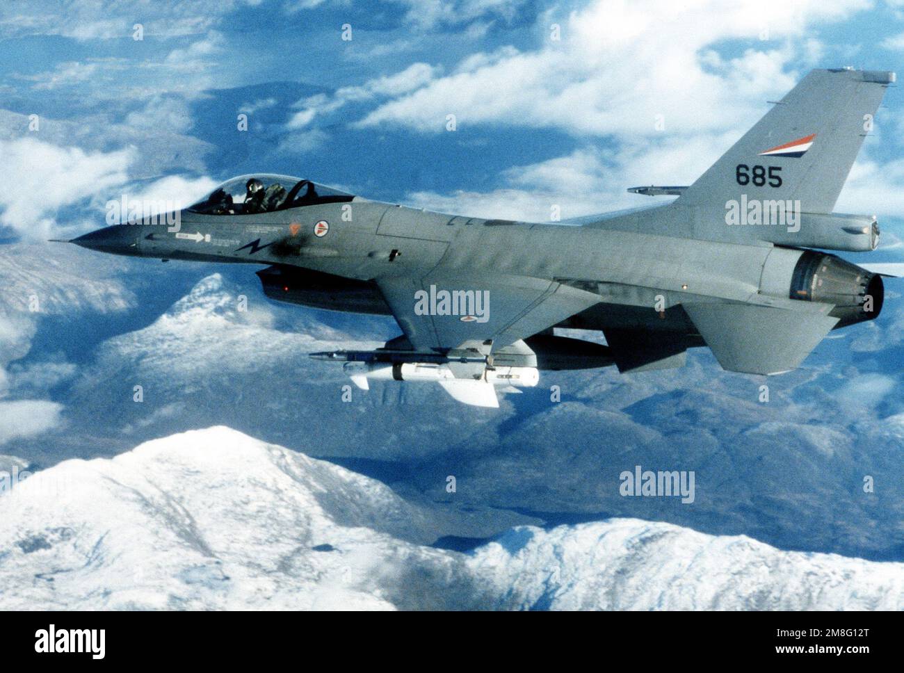 An AGM-119A Penguin anti-ship missile is mounted on the pylon of a ...