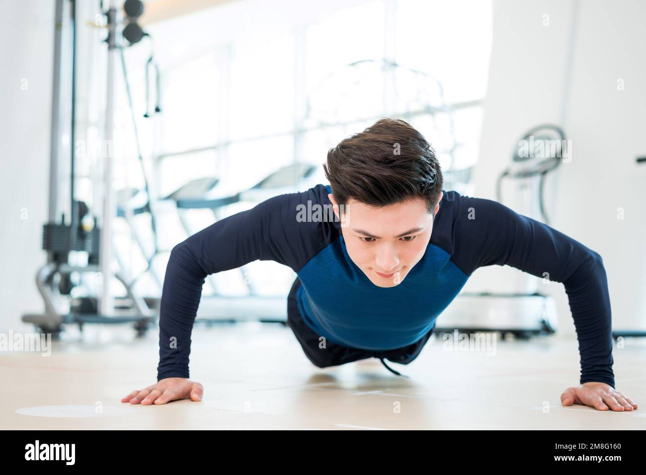 The young man to do push-ups Stock Photo - Alamy