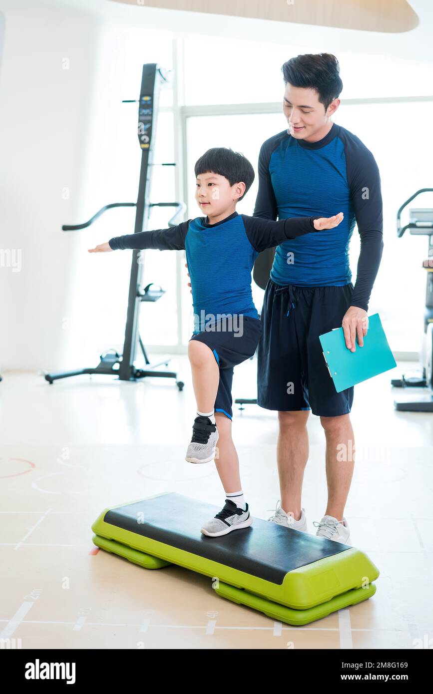 Father and son out in the gym Stock Photo - Alamy