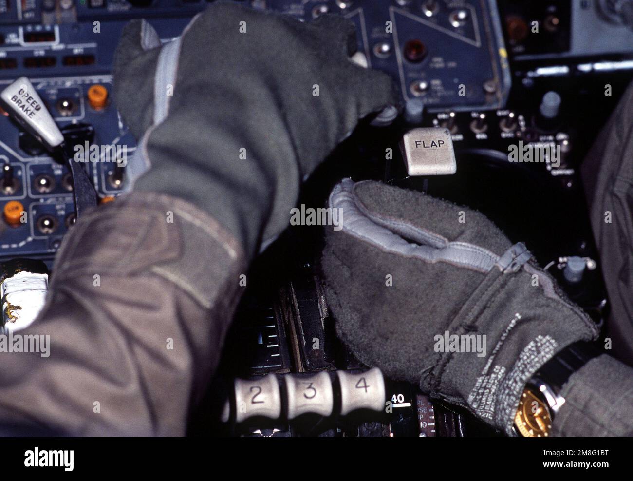Air crew members from the 38th Strategic Reconnaissance Squadron adjust ...