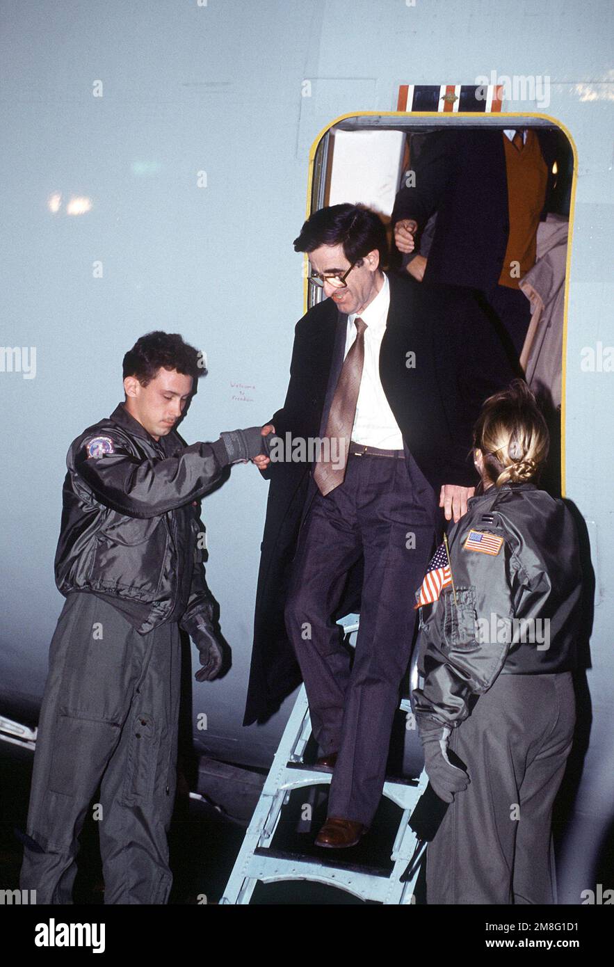 Members of the 86th Airlift Squadron assist freed hostage Joseph ...