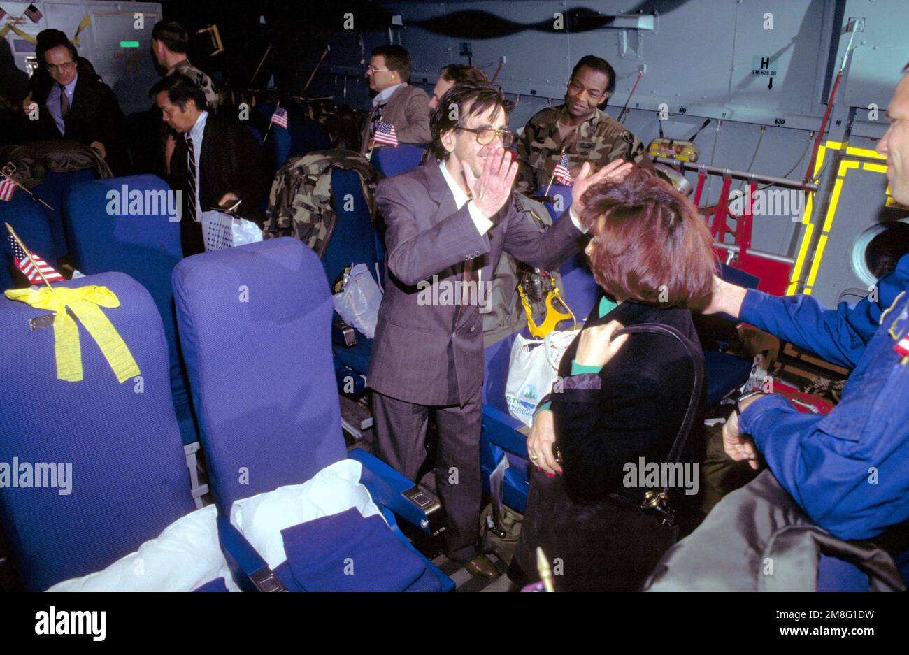 Freed hostage Joseph Cicippio expresses his joy as he boards a C-141B ...