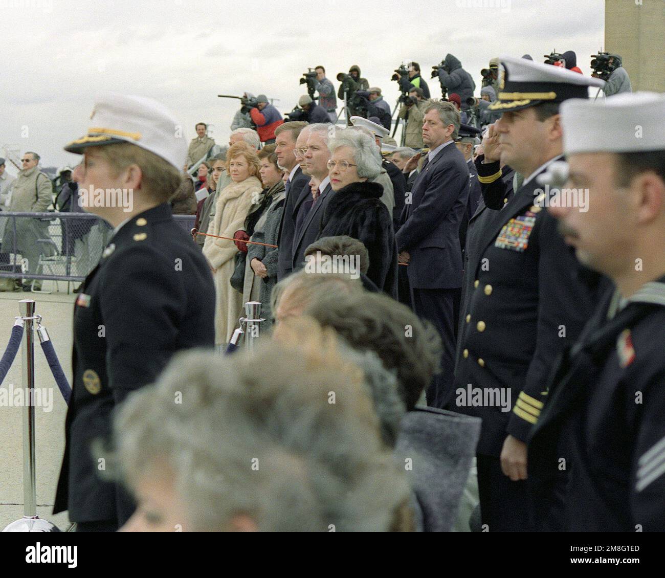 MAJ Robin Higgins stands in the crowd during memorial services for her ...