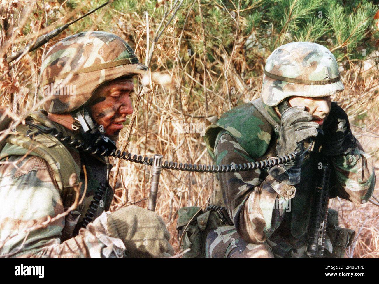 Members of the 1ST, 506th Infantry Battalion on field phone during a Live Fire training exercise ...