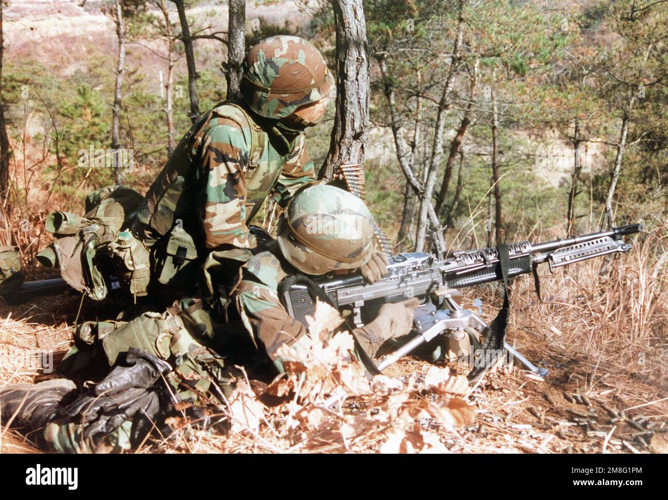 Members of the 1ST, 506th Infantry Battalion aim down range using a M60 ...