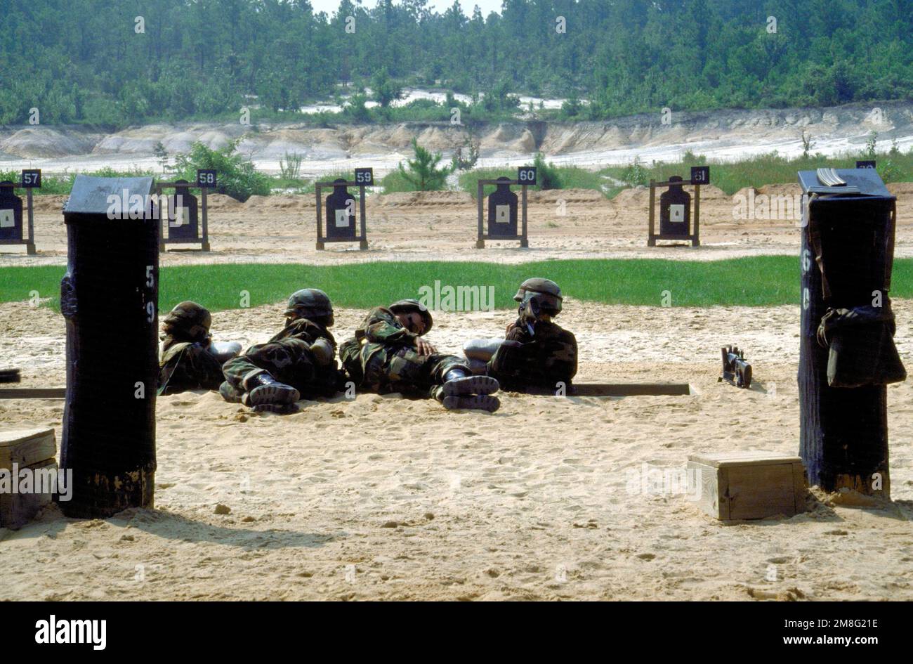 Soldiers prepare to take aim at targets on the firing range during ...