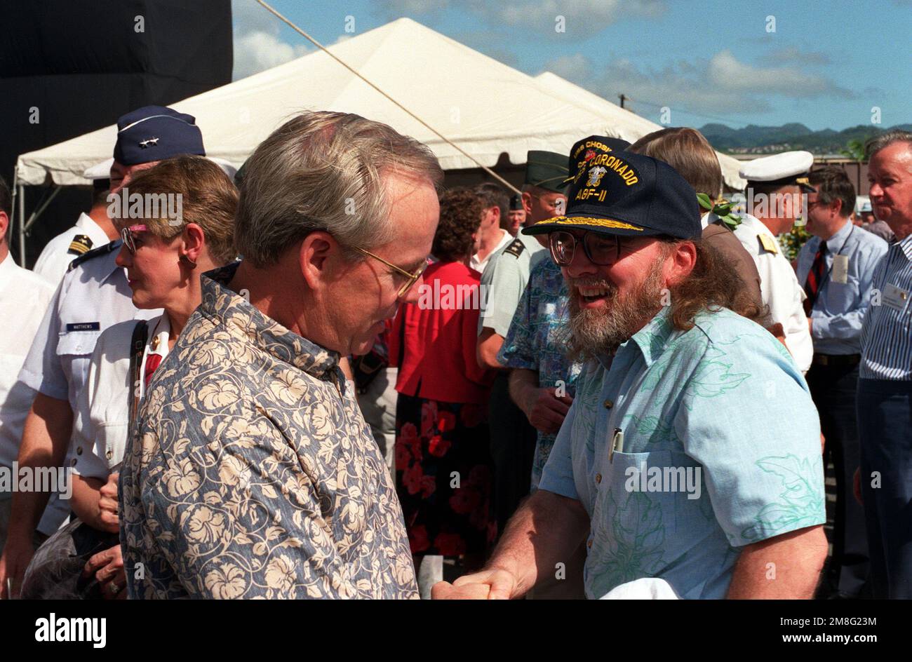 Secretary of the Navy H. Lawrence Garrett III greets a guest during ...