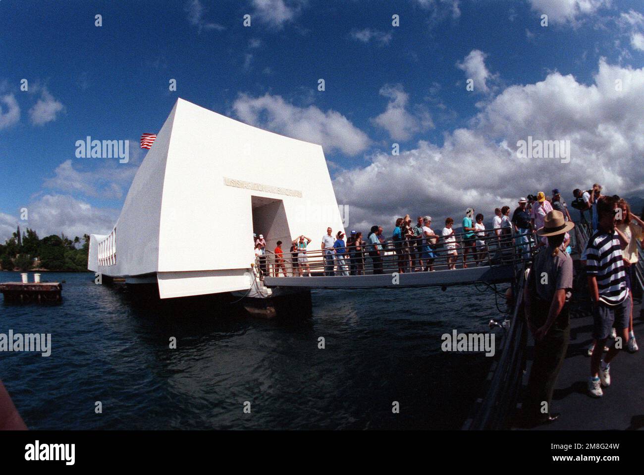 USS ARIZONA survivors and their families file out of the USS ARIZONA ...