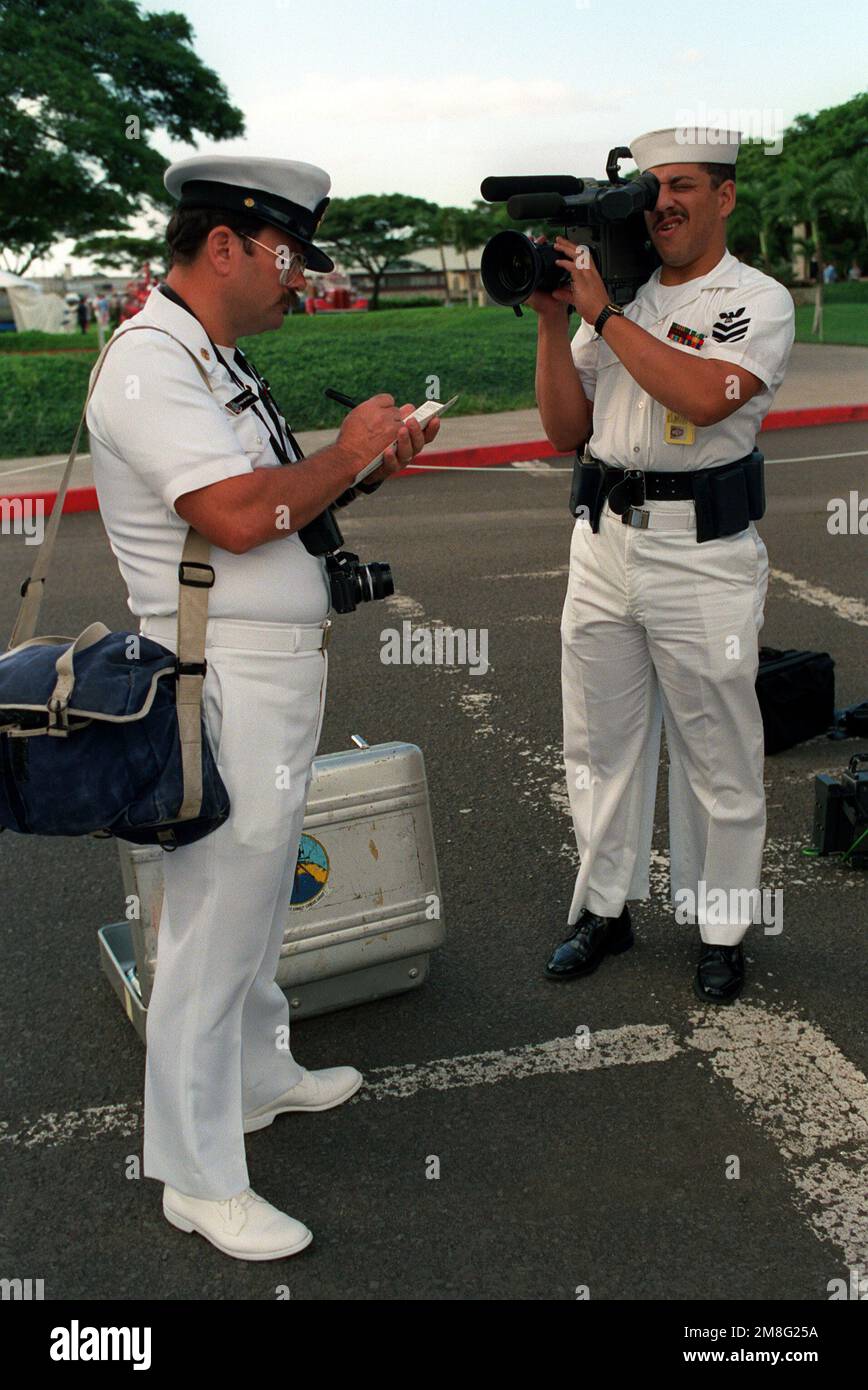 Members of Fleet Imaging Command Pacific check their equipment before ...