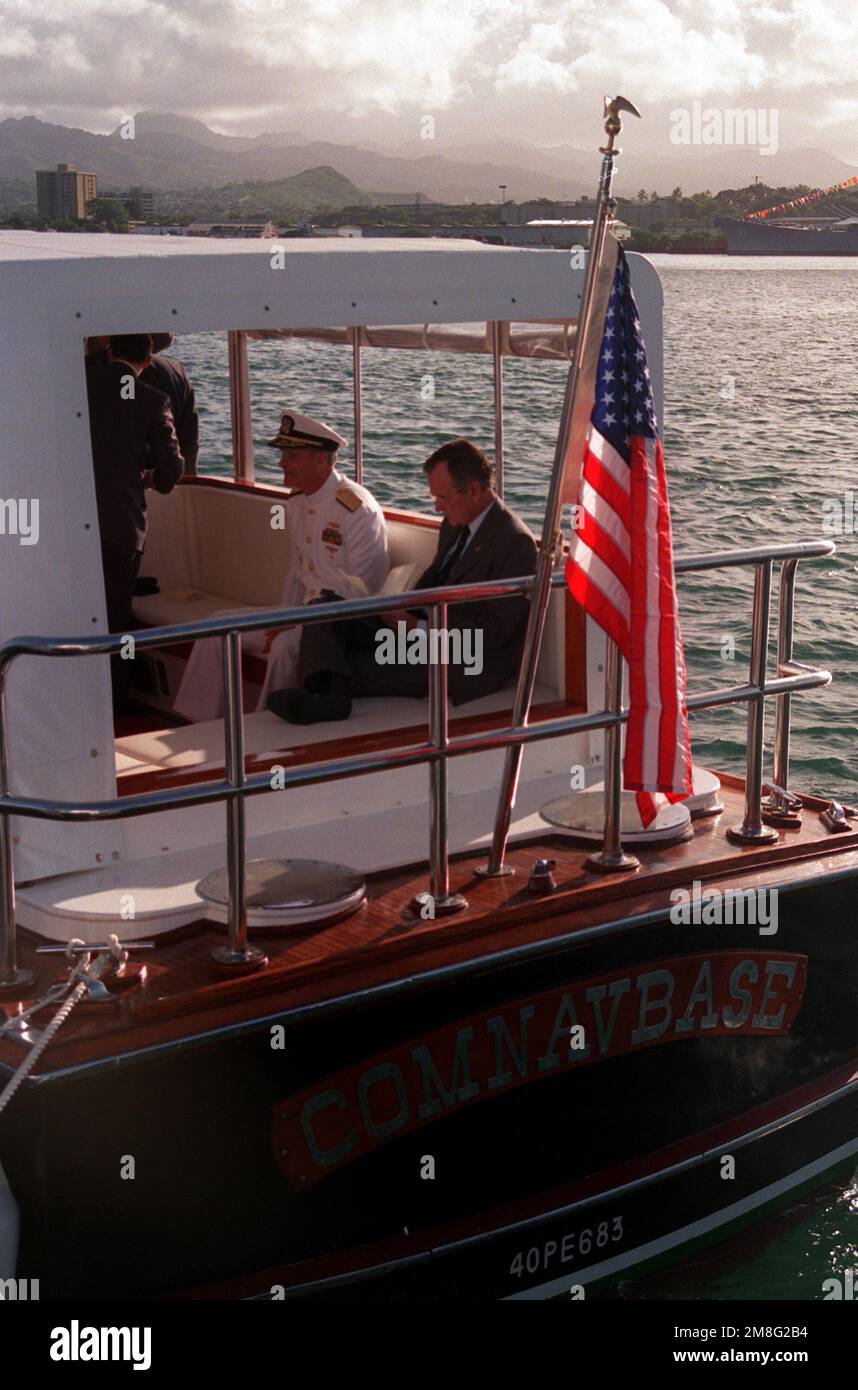 President George Bush sits with ADM Charles R. Larson, commander in ...