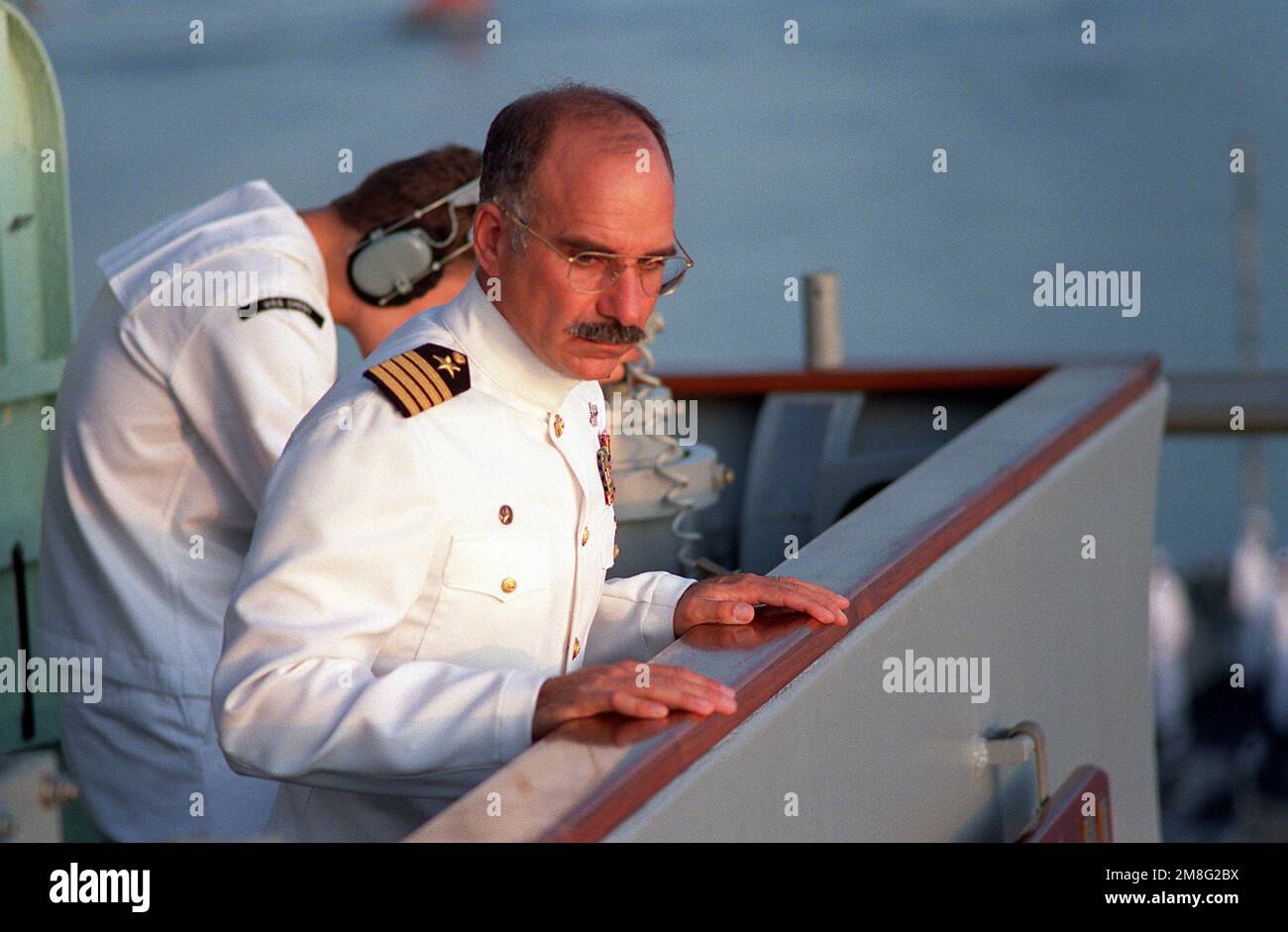 The commanding officer of the guided missile cruiser USS CHOSIN (CG-65 ...