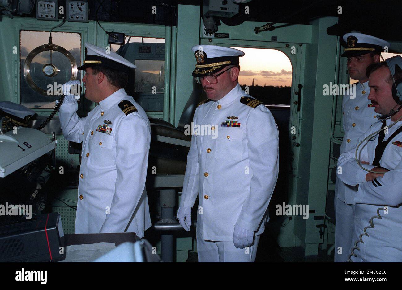 Officers man the bridge of the guided missile cruiser USS CHOSIN (CG-65 ...